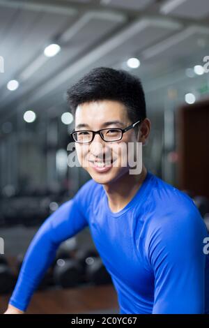 Chinese man working out with dumbbell on black background Stock Photo ...