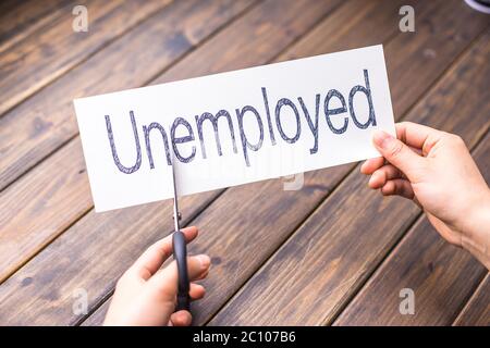 unemployed to employed on white paper Stock Photo - Alamy