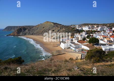 Beach in the fishing village of Burgau in the Algarve, Portugal Stock ...