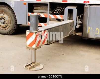 Truck outrigger stabilizing legs extended Stock Photo - Alamy