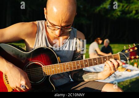young man learning how to play guitar on computer Stock Photo - Alamy