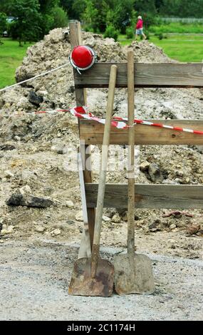 Two shovels in ground Stock Photo - Alamy