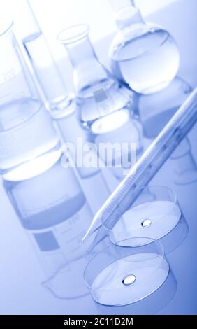 Test tubes on blue background Stock Photo - Alamy