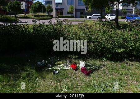 Linkoping, Sweden 20200610 Flowers and candles at the murder scene ...