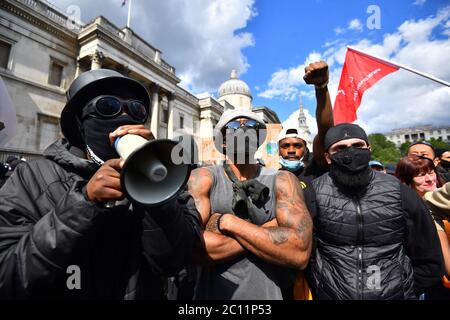 People linking arms during a Black Lives Matter protest rally in ...