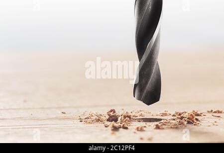 Flat drill bit make hole in drilling a hole in a wood plank Stock Photo ...