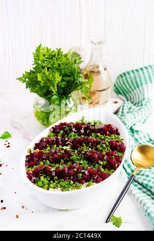 Pickled apples in bowl on white stone table. Close up. Traditional ...