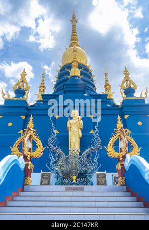 Gold Phra Sivali or Phra Sivalee Buddhist Monk Statue standing front of ...