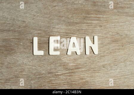 Alphabet letter in word lean on wood background Stock Photo - Alamy