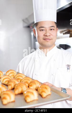 young man chelf makes bread in kitchen Stock Photo - Alamy