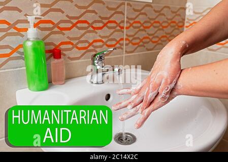 Writing note showing Humanitarian Aid. Business concept for immediate ...