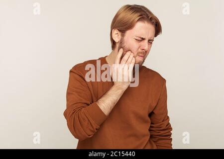 Dental problems. Portrait of unhealthy man with swollen face suffering ...