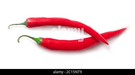 Two red chili peppers crossed Stock Photo - Alamy