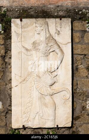 Replica relief carved tablet of the Roman god Vulcan in the sacred area ...