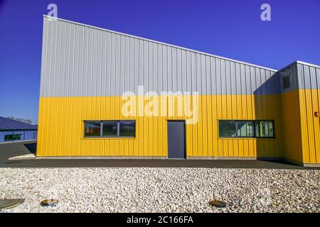 newly build modern red office building with warehouse Stock Photo - Alamy