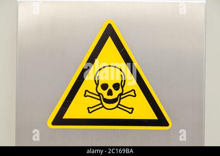 Yellow triangle with skull and crossbones symbol warning about ...