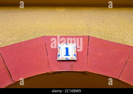 Home number 1 decorative numeral tiles on house entrance Stock Photo ...