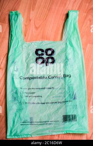 Compostable carrier bag by Co-Op to use at home for food waste and home ...