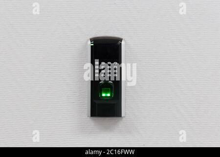 Fingerprint scanner on wall Stock Photo - Alamy