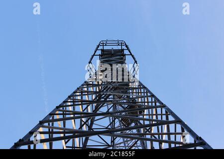 Large tower of metal structures against the blue sky. Metal ...