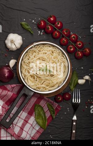 Closeup of delicious spaghetti in a pan. Top view Stock Photo - Alamy