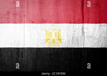 National flag of Egypt depicting in paint colors on an old brick wall ...