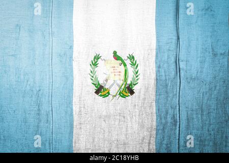 National flag of Guatemala depicting in paint colors on an old stone ...
