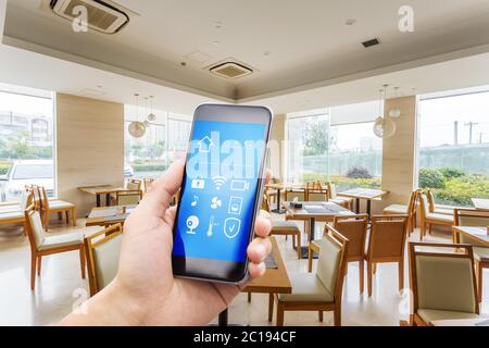 smart phone with smart home with modern cafeteria Stock Photo - Alamy