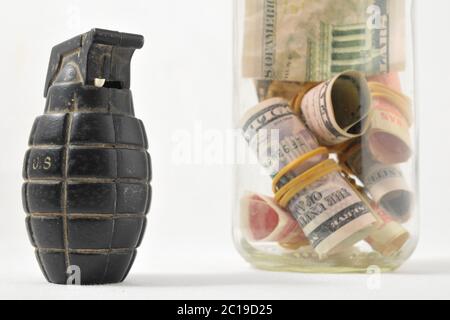 Money for War Concept Hand Grenade and Money Stock Photo - Alamy