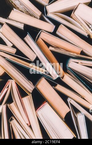 A pile of traditional colorful books, different sizes, big and small ...