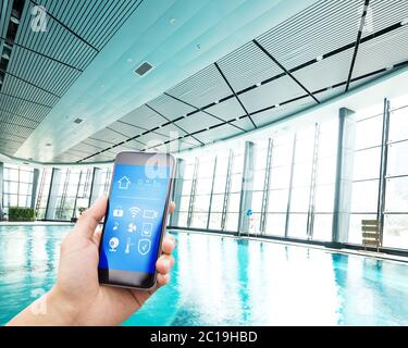 smart phone with smart home with modern swimming pool Stock Photo - Alamy