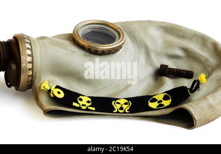 trophies of the stalker: old Russian gas mask, rusty nail and yellow ...