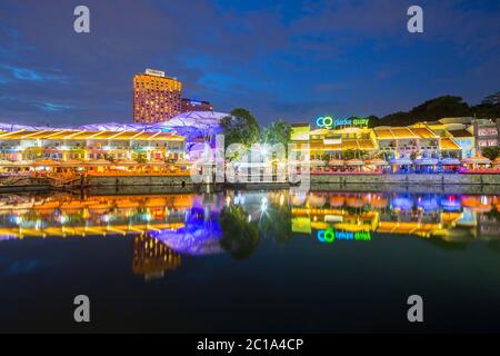 Night photography scene of Clarke Quay, with water reflection to give ...