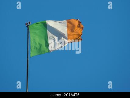 Irish Flag of Ireland over blue sky Stock Photo - Alamy