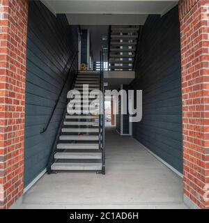 Square Internal stairs from a ground floor foyer Stock Photo - Alamy