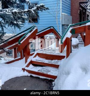 Square crop Stairs with green handrails and grate metal treads built on ...