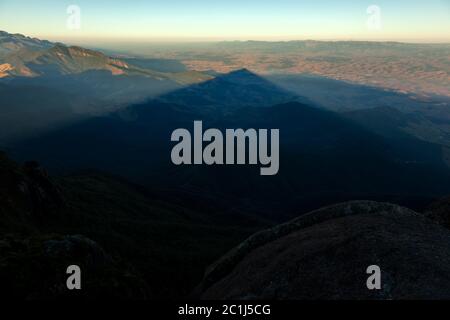 Triangular shadows of a mountain seen from the summit in mantiqueira ...