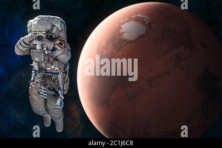 Planet Mars on a dark background. Elements of this image furnished by ...