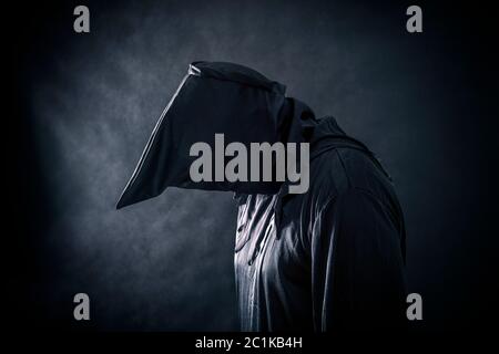 Spooky monster in hooded cloak isolated on white background Stock Photo ...