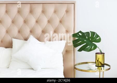 Modern bedroom with table side and pillows and coffee. Close up Stock ...