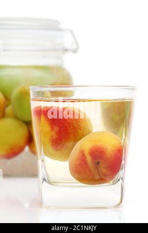 Glass bottle with homemade Japanese ume su, plum vinegar, close up and ...