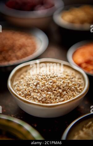 Raw Flax seeds in a ceramic plate close up Stock Photo - Alamy