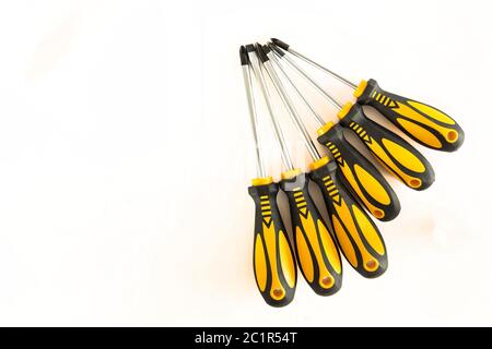 Set of screwdrivers with rubber black and yellow handles isolated on a ...