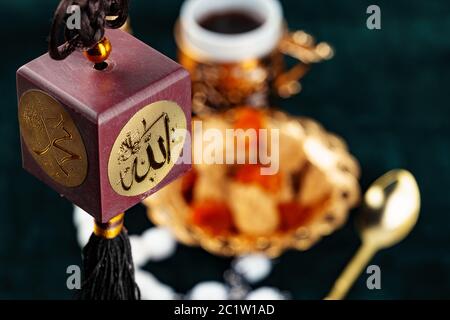 Muslim amulet of bordeux color on rope Stock Photo - Alamy