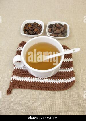 Cup of cacao husk tea from the roastet outer shells of the cacao bean ...