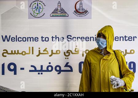 A health worker stands by a drive-through COVID 19 testing post amidst ...