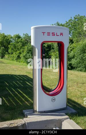 Tesla electric cars at a Tesla Super Charger power station at a highway ...
