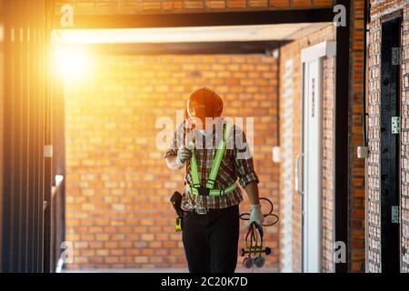 male air conditioning technician smiling at the camera Stock Photo - Alamy