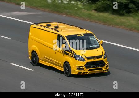 Yellow moving van on a city road Stock Photo - Alamy