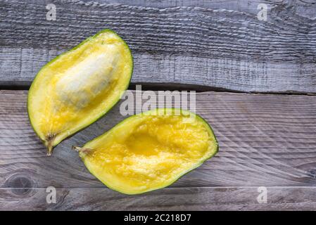 Cross section of mango fruit cut into cubes with a leaf. File contains ...